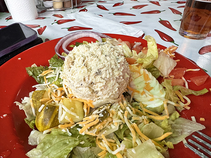 This chicken salad doesn't just sit on lettuce&mdash;it commands the plate like a general. The pickle stands guard against any vegetable rebellion. 