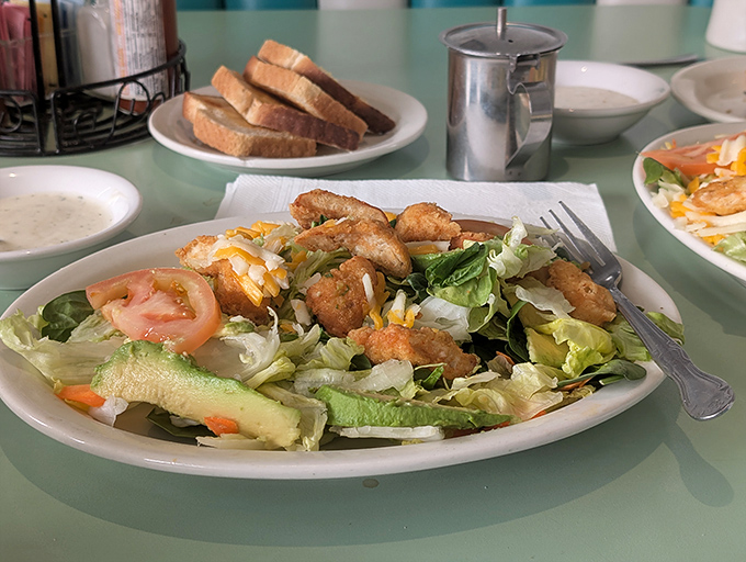 Salads at diners deserve more credit. This one brings crunch, color, and those golden chicken bites that make eating greens feel like cheating.