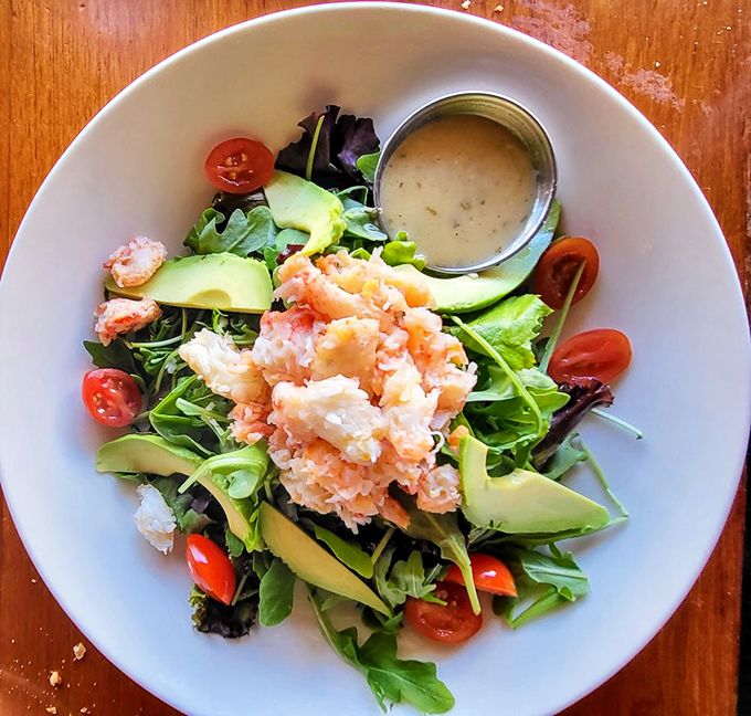 A salad that makes eating greens feel like an indulgence: fresh crab, avocado, and greens playing together like old friends at a reunion.