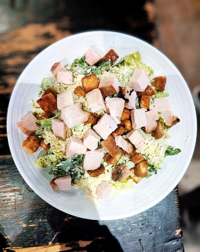 Even the Caesar salad gets the barbecue treatment with generous chunks of smoky meat on top.