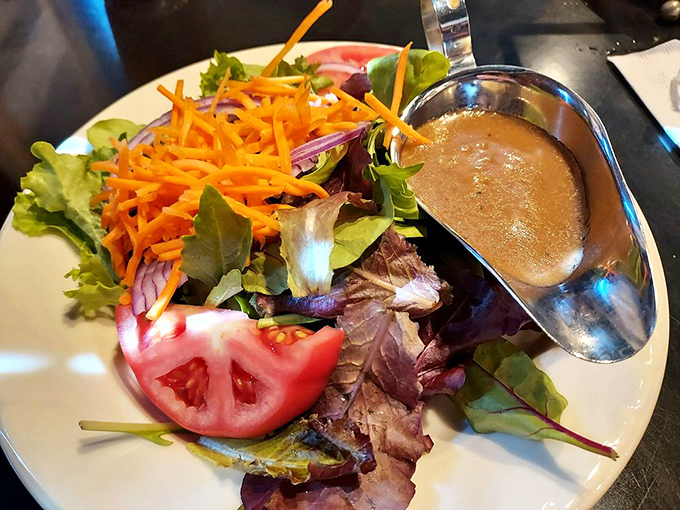 A garden-fresh salad that doesn't apologize for being healthy&mdash;crisp greens, vibrant carrots, and that house dressing you'll wish came by the bottle.