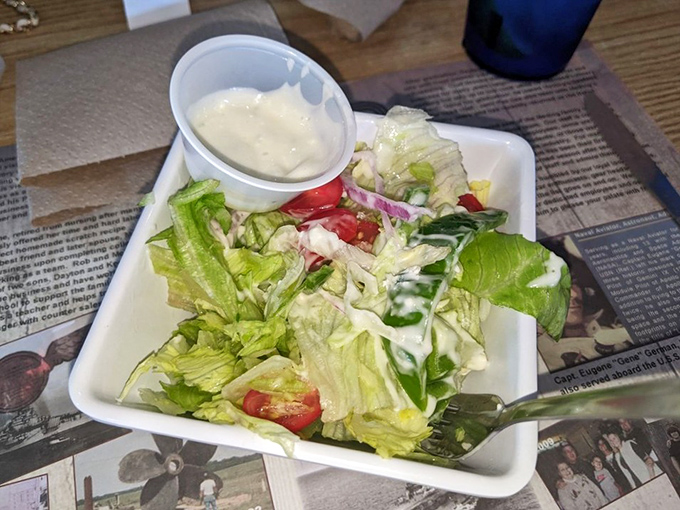 A simple house salad that knows its purpose &ndash; to provide the lightest counterpoint to the seafood feast that's about to unfold.