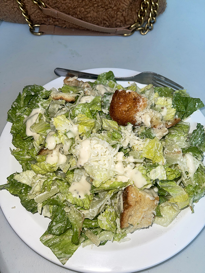 A Caesar salad for those pretending they came for something healthy before ordering three sandwiches to go.