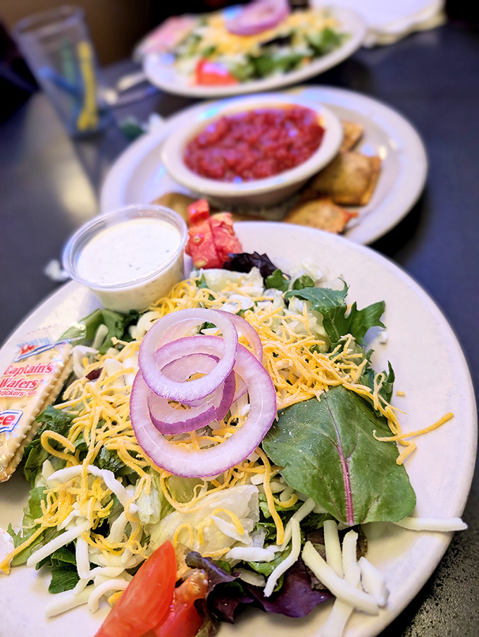 A salad that doesn't apologize for being healthy. Those red onions and shredded cheese add just enough indulgence to keep things interesting. 