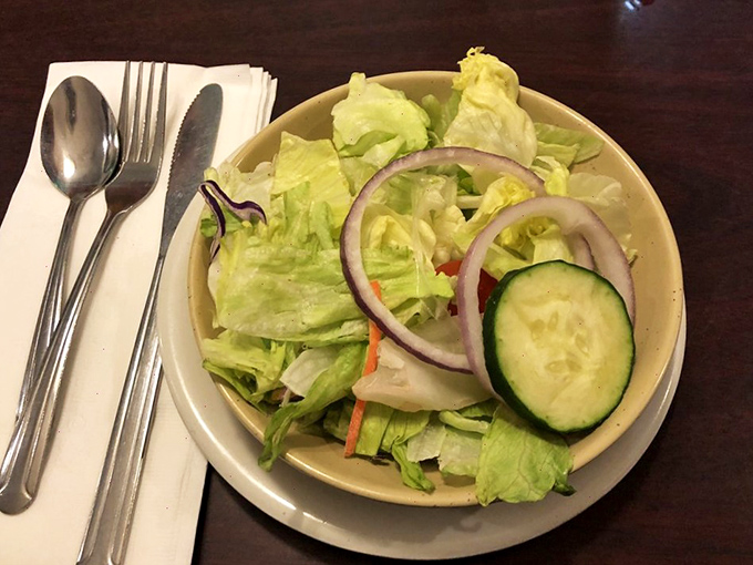 Even the side salad gets respect here &ndash; crisp lettuce, fresh cucumber, and red onion ready to provide the virtue before the indulgence.