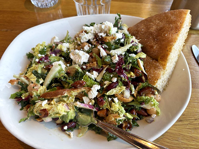 This isn't just a salad; it's a colorful convention where greens, cheese, and nuts gather to prove that "healthy" and "delicious" aren't mutually exclusive terms.