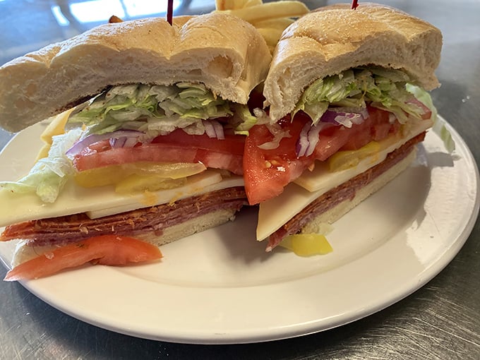 This sandwich stacks ingredients like an edible skyscraper built for serious appetites and satisfaction.