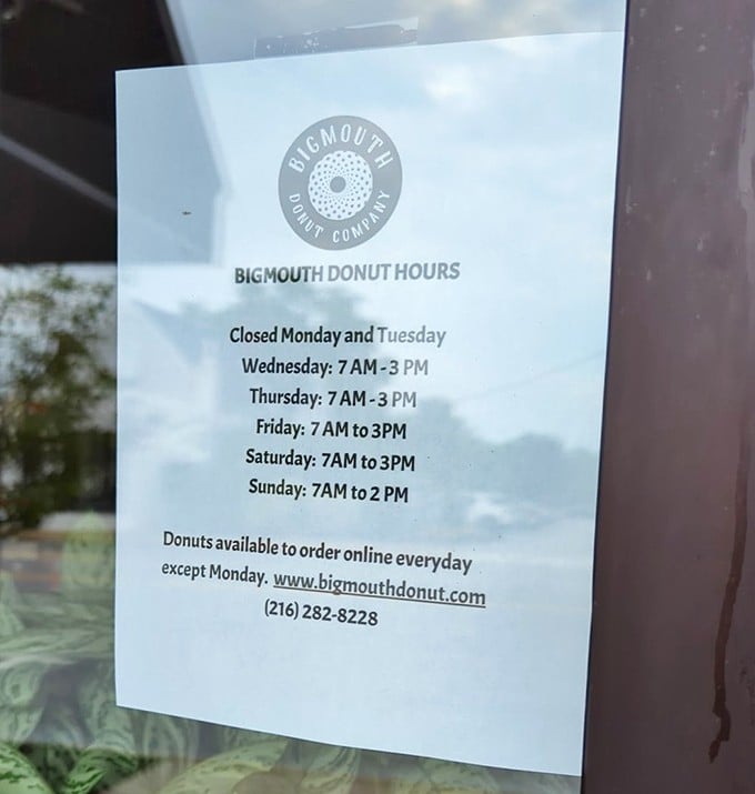 The hours posted clearly&mdash;because knowing when you can get your next donut fix is information more crucial than the weather forecast.