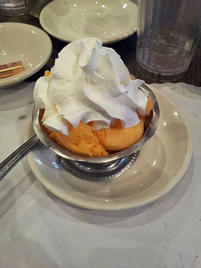 This isn't just dessert&mdash;it's a cloud of whipped cream floating atop a sherbet sunrise. The perfect sweet finale to a diner feast. 