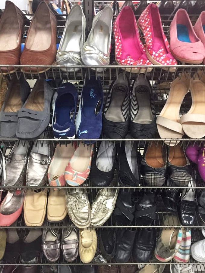 Women's shoes lined up like hopeful contestants, each pair waiting for Cinderella to come along and give them a second life.