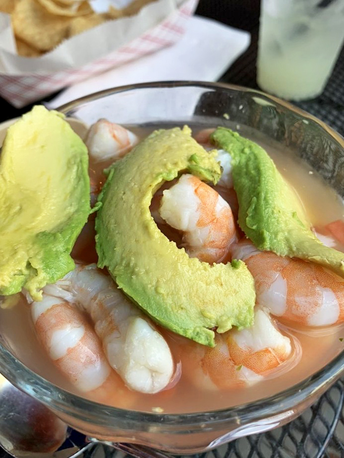 The famous shrimp soup is like a warm hug in a bowl—plump shrimp, fresh avocado, and a broth so good you'll contemplate drinking it straight.