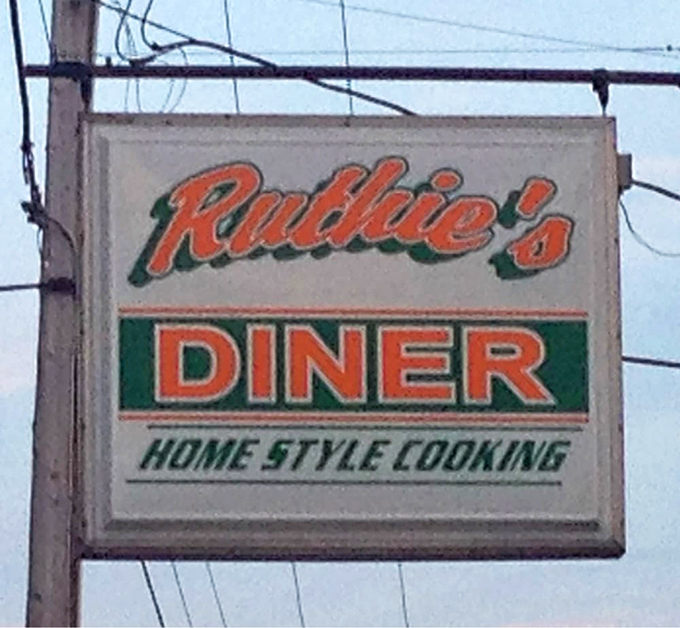 The sign promises "Home Style Cooking" in bold letters—perhaps the only advertising claim in America that consistently delivers exactly what it promises.