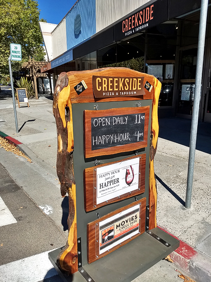 A sign that doesn't just tell you when they're open, but promises that happy hour is actually happier. Truth in advertising!