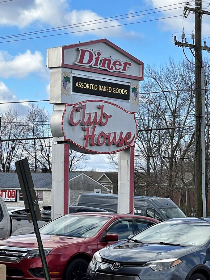 The sign promises "Assorted Baked Goods," but what it really means is "Resistance Is Futile." Your diet doesn't stand a chance.