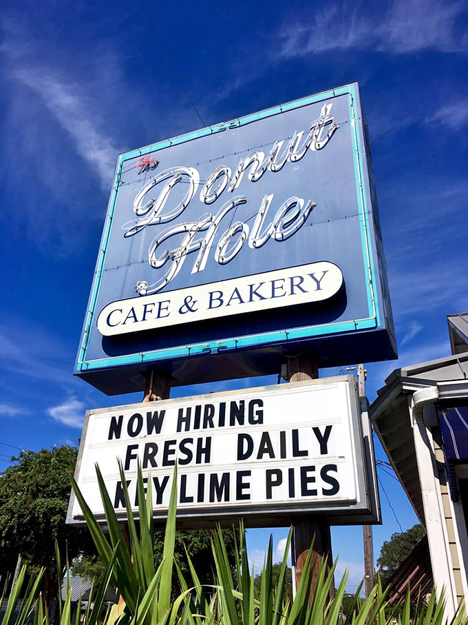 The sign against Florida's impossibly blue sky promises two essential things: employment opportunities and fresh key lime pies. Both equally important.