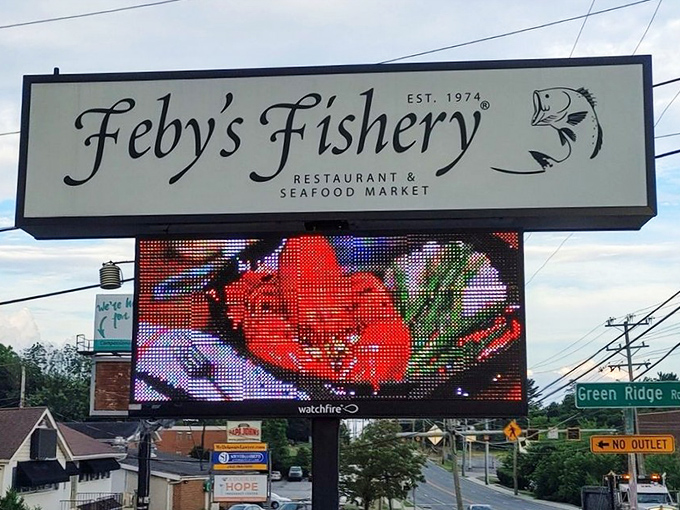 The roadside sign glows like a beacon for hungry travelers&mdash;a digital lighthouse promising safe harbor for seafood cravings.