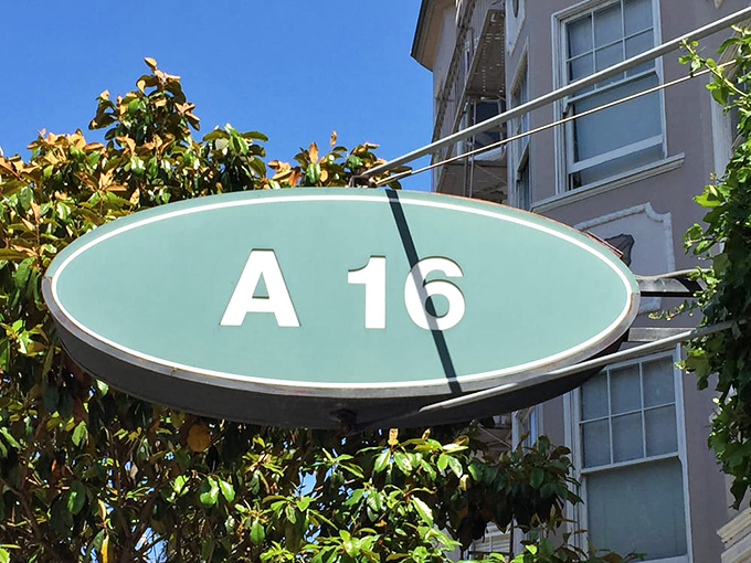 The iconic mint-green A16 sign isn't just a marker&mdash;it's a beacon guiding hungry travelers to their Southern Italian destination.