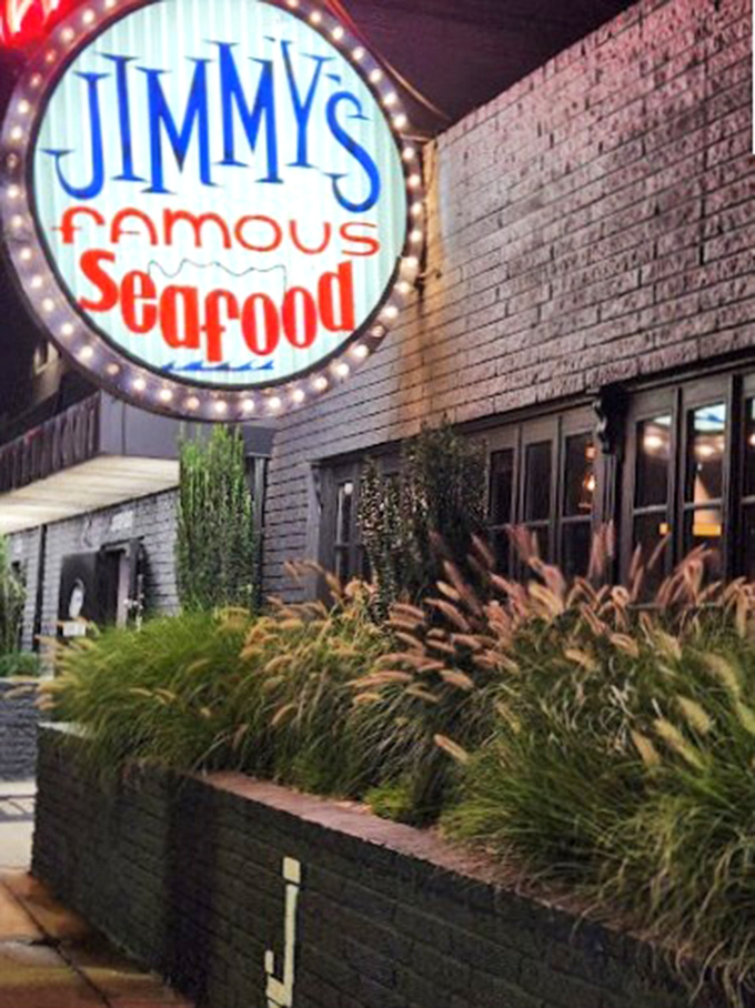 The neon sign glows like a beacon in the night, drawing seafood lovers like moths to a deliciously crabby flame.