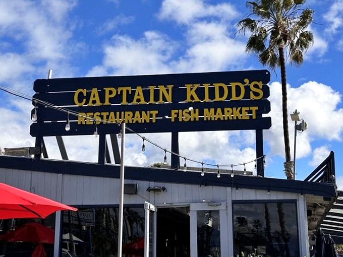 Against that perfect California sky, the sign stands as a landmark for those in-the-know seeking authentic seafood experiences.