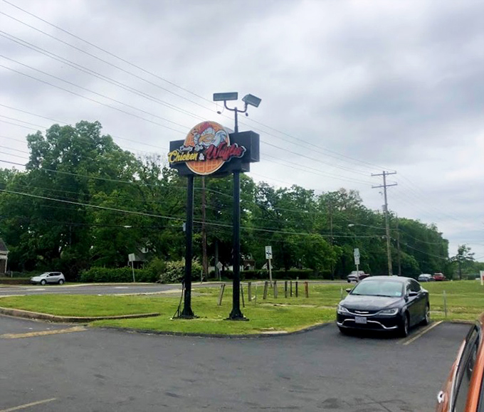 The roadside sign stands tall, a landmark for hungry travelers and locals alike. It's not just a sign—it's a promise of good things to come.