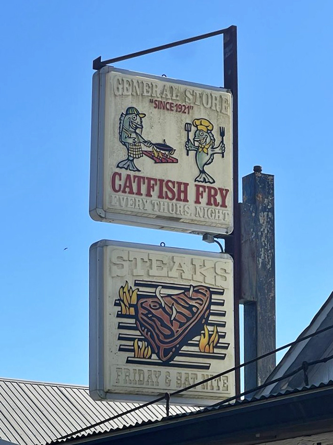 Twin signs promising catfish and steaks &ndash; like a beacon calling hungry travelers home since 1921.