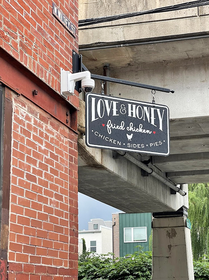The hanging sign serves as a beacon for fried chicken pilgrims. Follow it like the North Star of comfort food that it is.