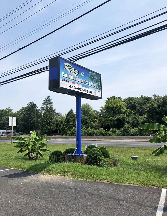The sign that guides hungry travelers to flavor paradise. Like a Caribbean lighthouse beckoning you toward delicious waters.