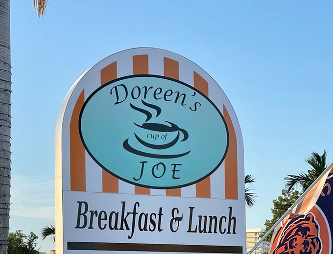 A sign that doesn't just mark a location&mdash;it promises a morning transformation. Those orange stripes are basically runway lights guiding you to breakfast bliss.