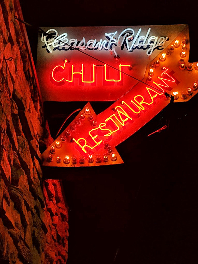 That neon sign has guided hungry night owls for generations. Like a lighthouse for those seeking late-night gravy cheese fries salvation.