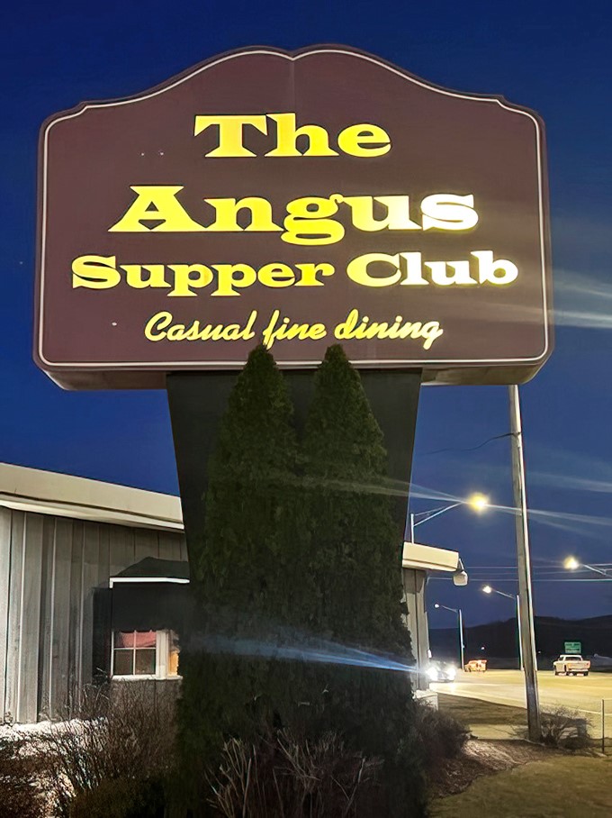 The sign against twilight sky announces "Casual fine dining"&mdash;Wisconsin's way of saying "Come as you are, eat like royalty."