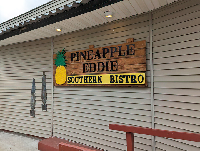 The wooden sign with its cheerful pineapple logo serves as a beacon of Southern hospitality in Pennsylvania's northwestern corner.