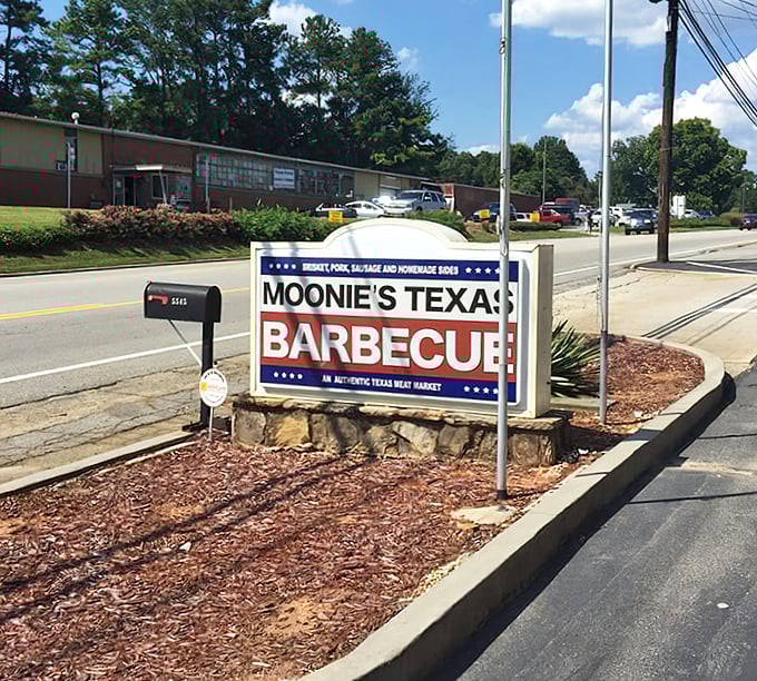 The roadside sign announces itself with Texas-sized confidence. No flashy gimmicks needed when the meat speaks for itself.
