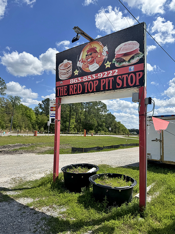The sign beckons like a BBQ lighthouse, guiding hungry travelers to a safe harbor of smoked meats and comfort food classics.