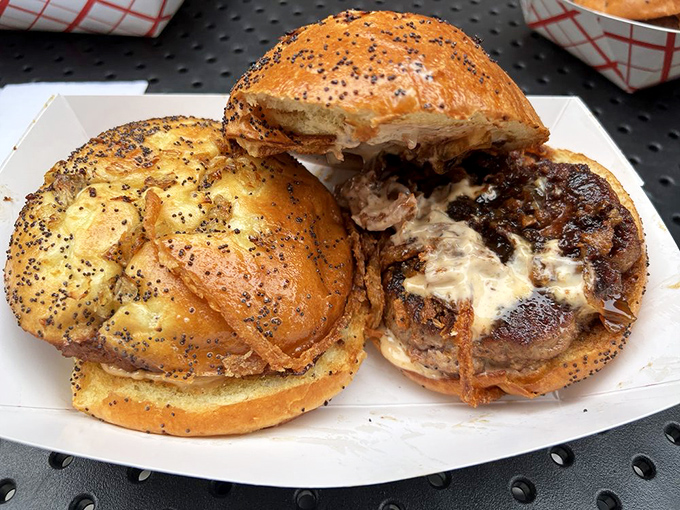 These aren't just burgers, they're happiness on a poppy seed bun. The melty cheese spilling over perfectly seared patties is pure comfort.