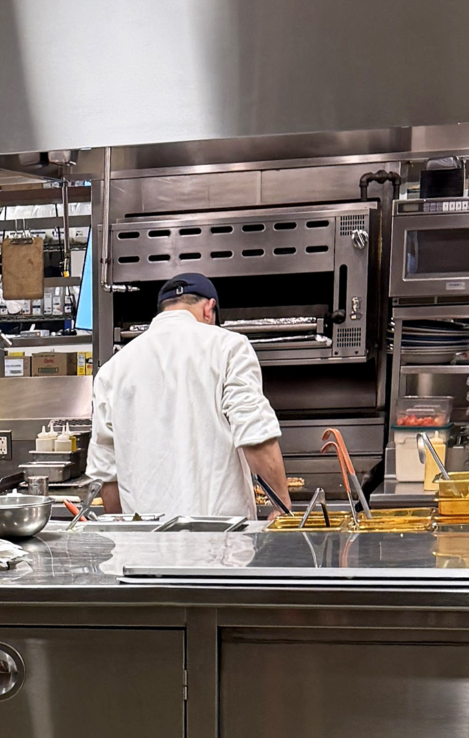 A chef in his natural habitat, focused on the alchemy that transforms simple ingredients into dishes worth writing home about.