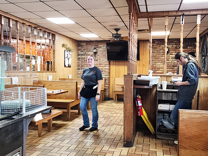 The dining area features warm wood tones and brick floors that have supported generations of hungry Ohioans seeking comfort food salvation.