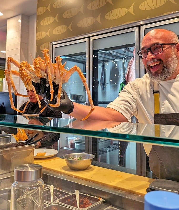 That moment when a chef proudly displays a massive king crab leg&mdash;it's like Excalibur, but tastier and from the sea.