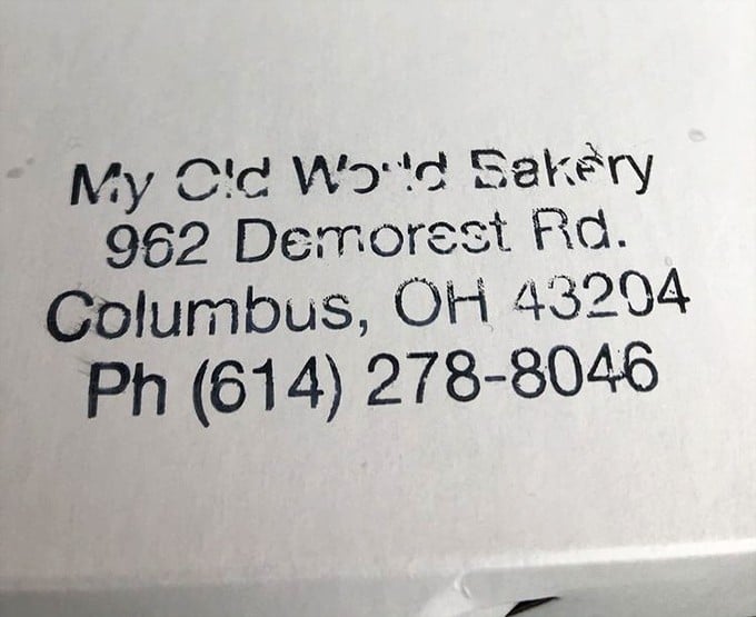 The bakery's contact information stamped with the same straightforward approach they bring to their pastries&mdash;no frills, just the facts.