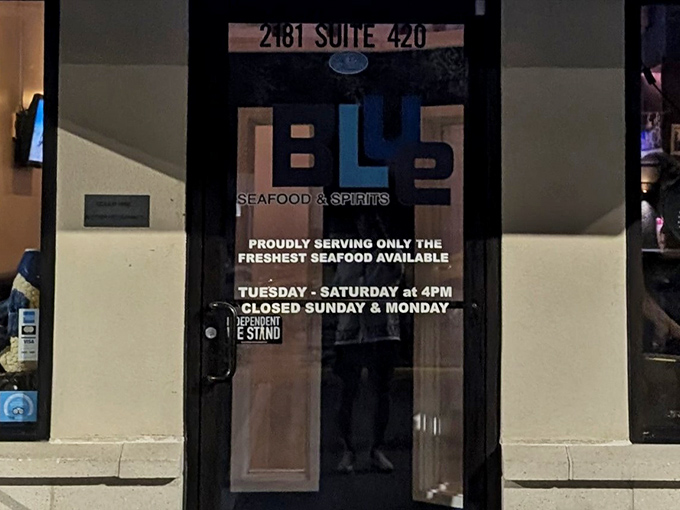 The door tells you everything you need to know: "PROUDLY SERVING ONLY THE FRESHEST SEAFOOD AVAILABLE." No compromises, no exceptions.