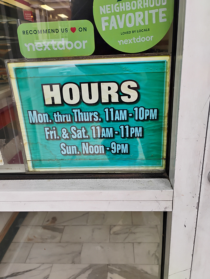 The hours sign might as well say "Times When Happiness Is Available." Seven days a week of pizza possibilities.