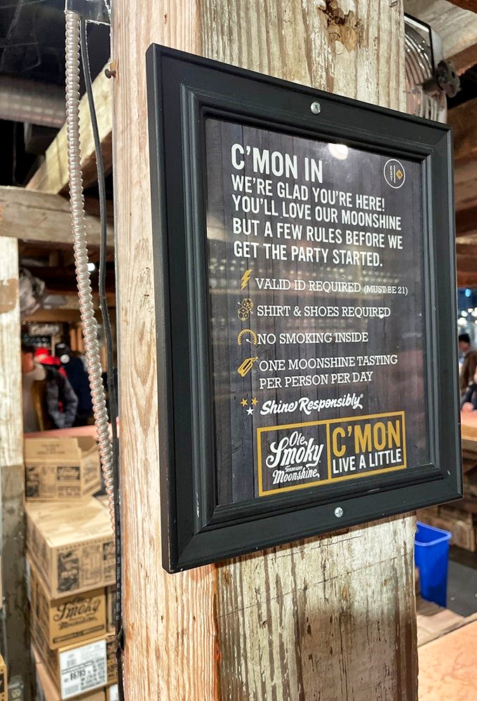 House rules for proper "shining"! This sign politely reminds visitors that while moonshine is now legal, responsible enjoyment is still the mountain way.