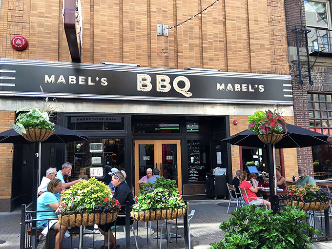 Outdoor seating surrounded by greenery&mdash;because sometimes you need fresh air between meat courses. Urban dining at its most civilized.