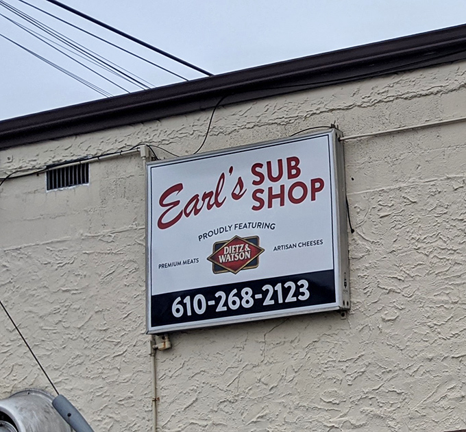 The sign proudly announces Earl's commitment to quality: Dietz & Watson premium meats and artisan cheeses aren't just ingredients, they're a philosophy.