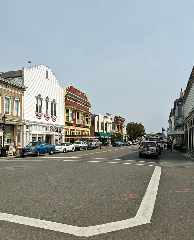 Main Street's gentle curve reveals a parade of Victorian facades, each one trying to out-charm the next in a very polite architectural competition.