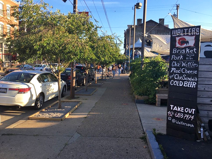 Street signage that gets straight to the point. When you're selling brisket, chicken and waffles, and cold beer, why complicate things?