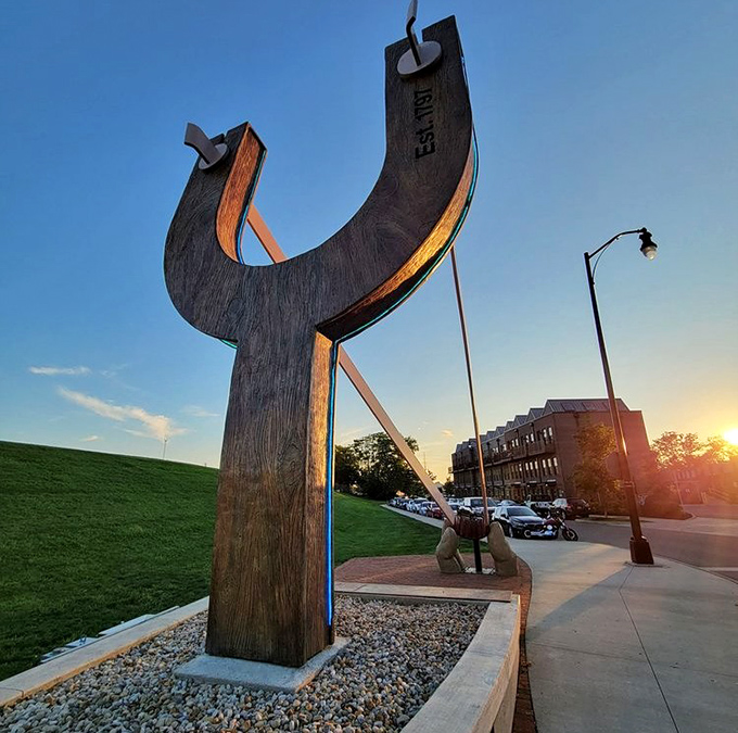 Sunset creates a magical backdrop for The Slingshot, silhouetting its distinctive shape against the fading light of an Ohio evening.