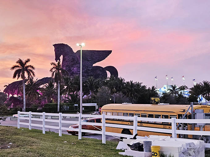 Sunset silhouettes a legendary battle. The pink-orange sky creates the perfect dramatic backdrop for this mythological showdown.