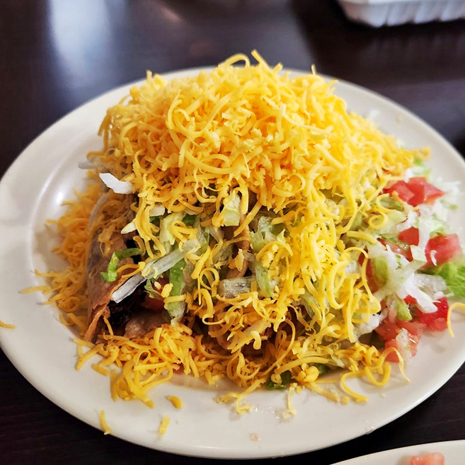 Some places serve food; El Tepeyac serves yellow cheese mountains atop meat valleys. This is what childhood dreams are made of.