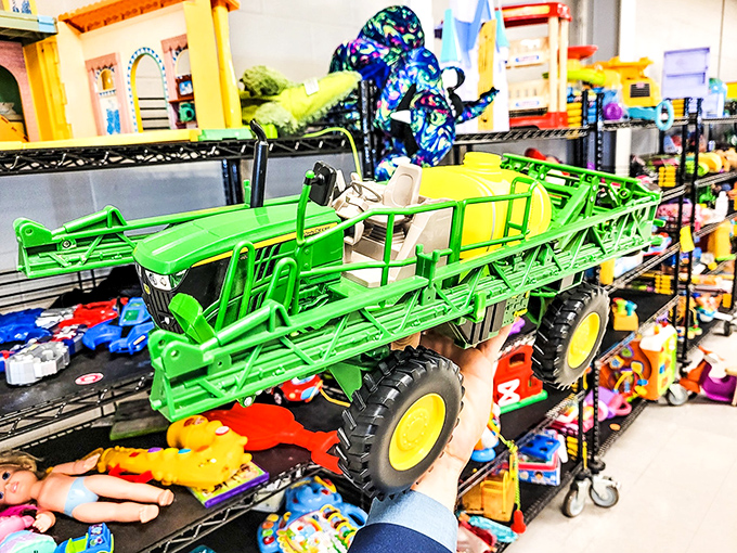 Toy department jackpot! That green farm equipment would make any kid (or nostalgic adult) the hero of the sandbox.