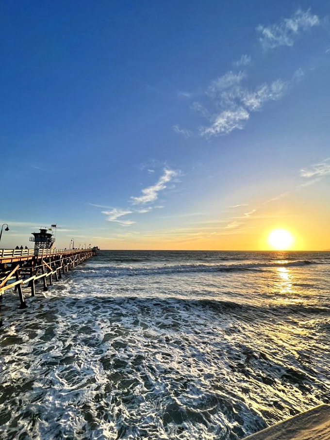 Mother Nature showing off at sunset, turning the Pacific into liquid gold – the perfect backdrop for your last bite of key lime pie.